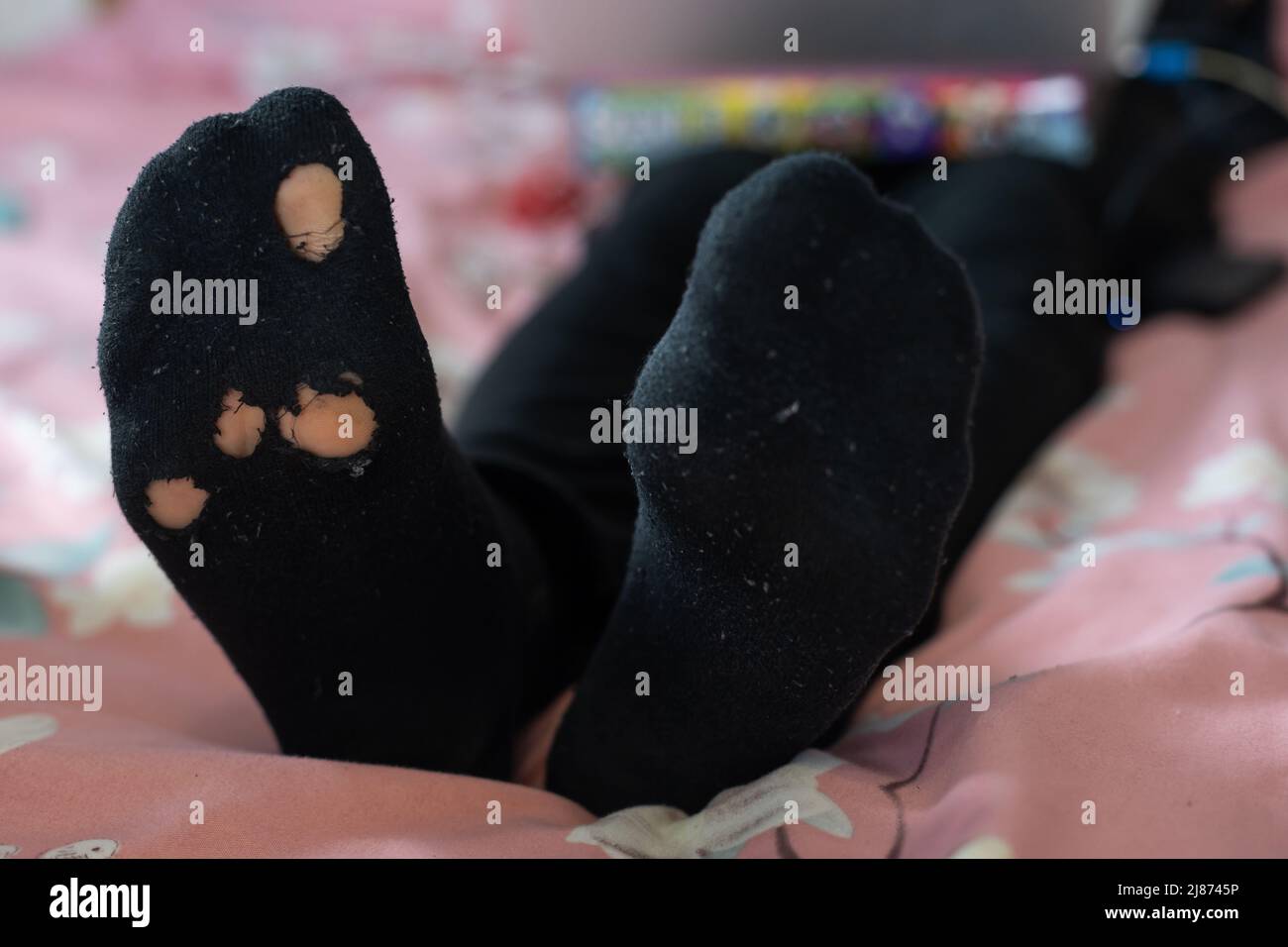 leaky socks on a man's leg, concept of poverty during the crisis Stock ...