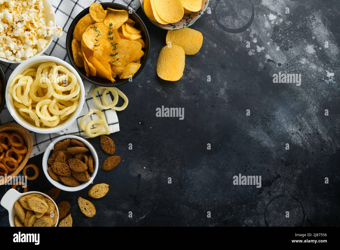Unhealthy food. Snacks. All classic potato snacks with peanuts, popcorn ...
