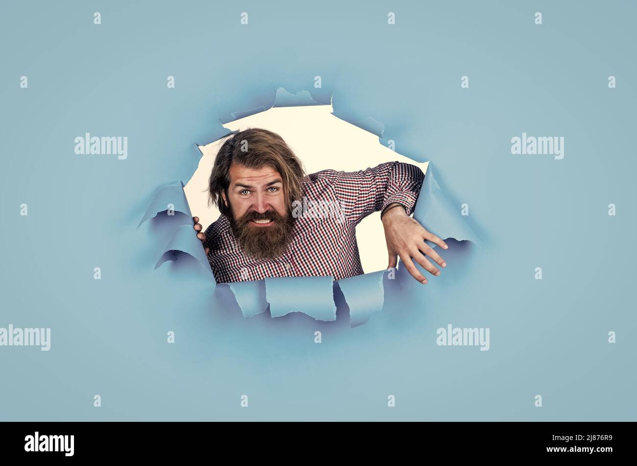 angry mature bearded guy has long hair, anger Stock Photo - Alamy