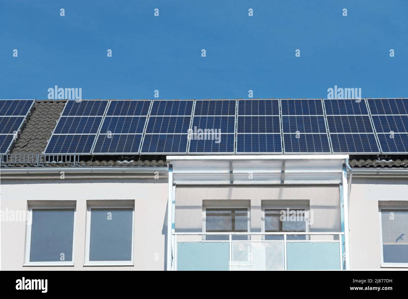 Solar system on the roof of a municipal building Stock Photo - Alamy