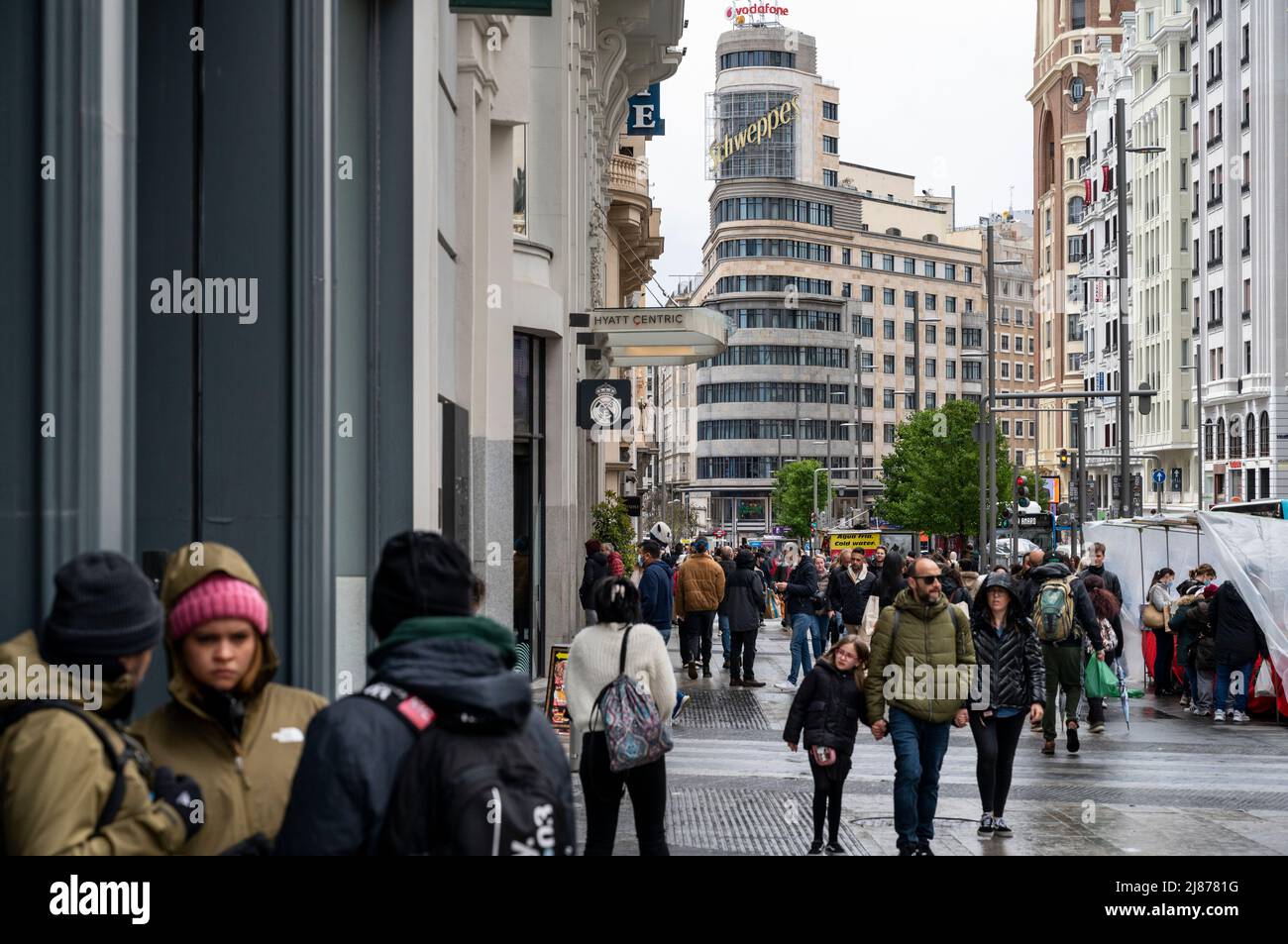 Pedestrians are seen at the Gran Via street, known for its numerous ...