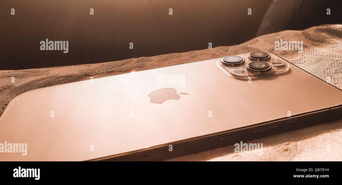The back of a gold Apple iphone - New Iphone on a white background ...