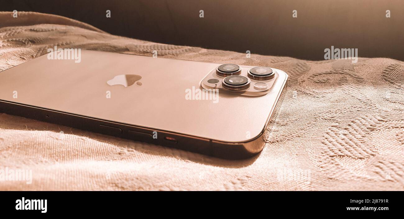 The back of a gold Apple iphone - New Iphone on a white background ...