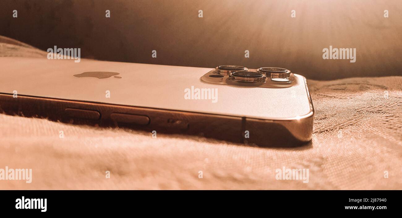 The back of a gold Apple iphone - New Iphone on a white background ...