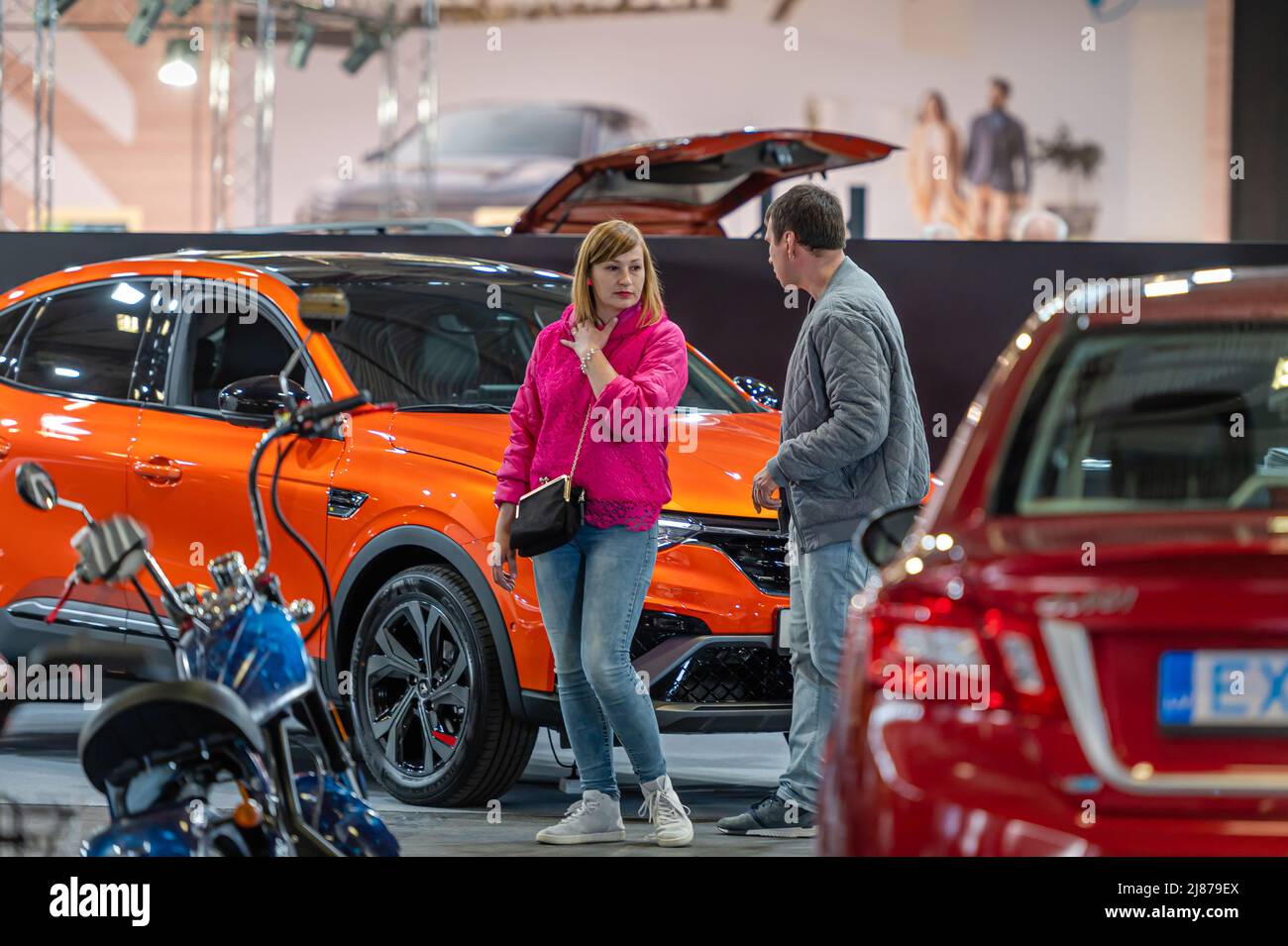 Riga, Latvia, April 29, 2022: people get acquainted with the new coupe ...