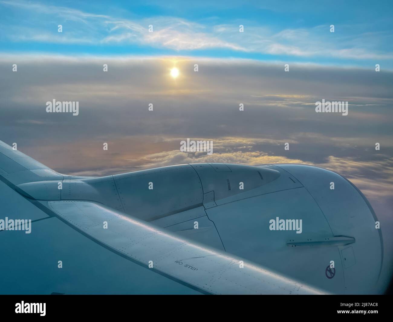 Beautiful clouds and sky at sunset as seen through window of an ...