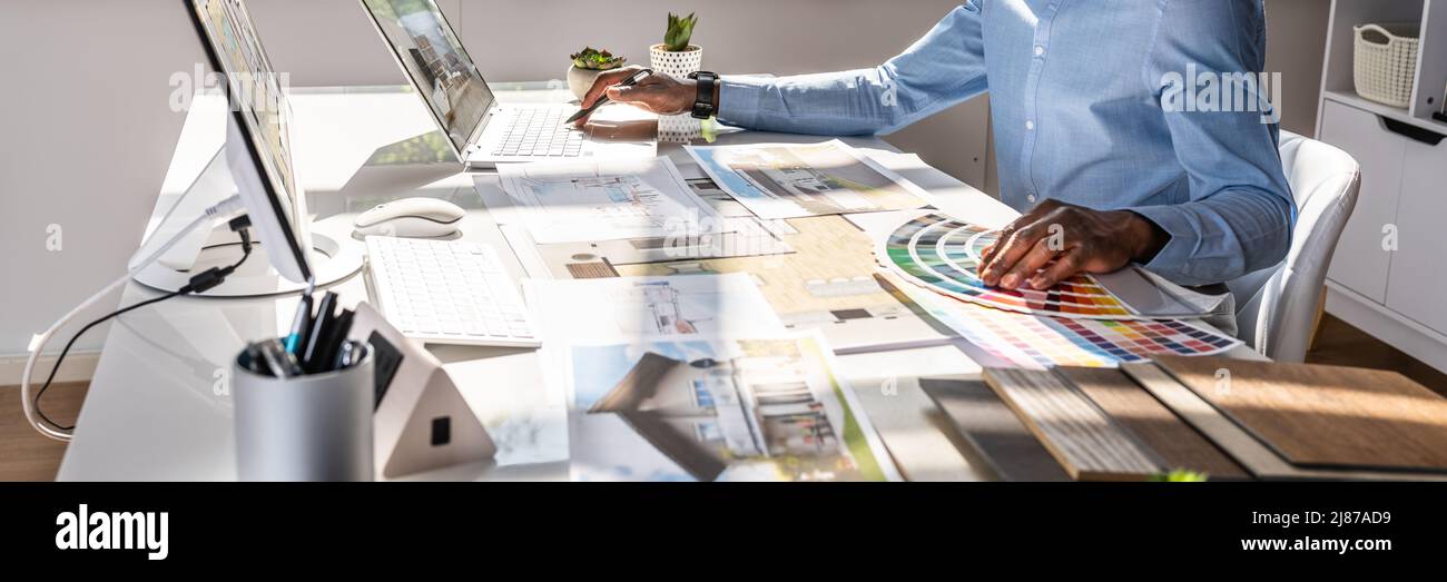 Side View Of Real Estate Designer Working On Computer In Office Stock ...