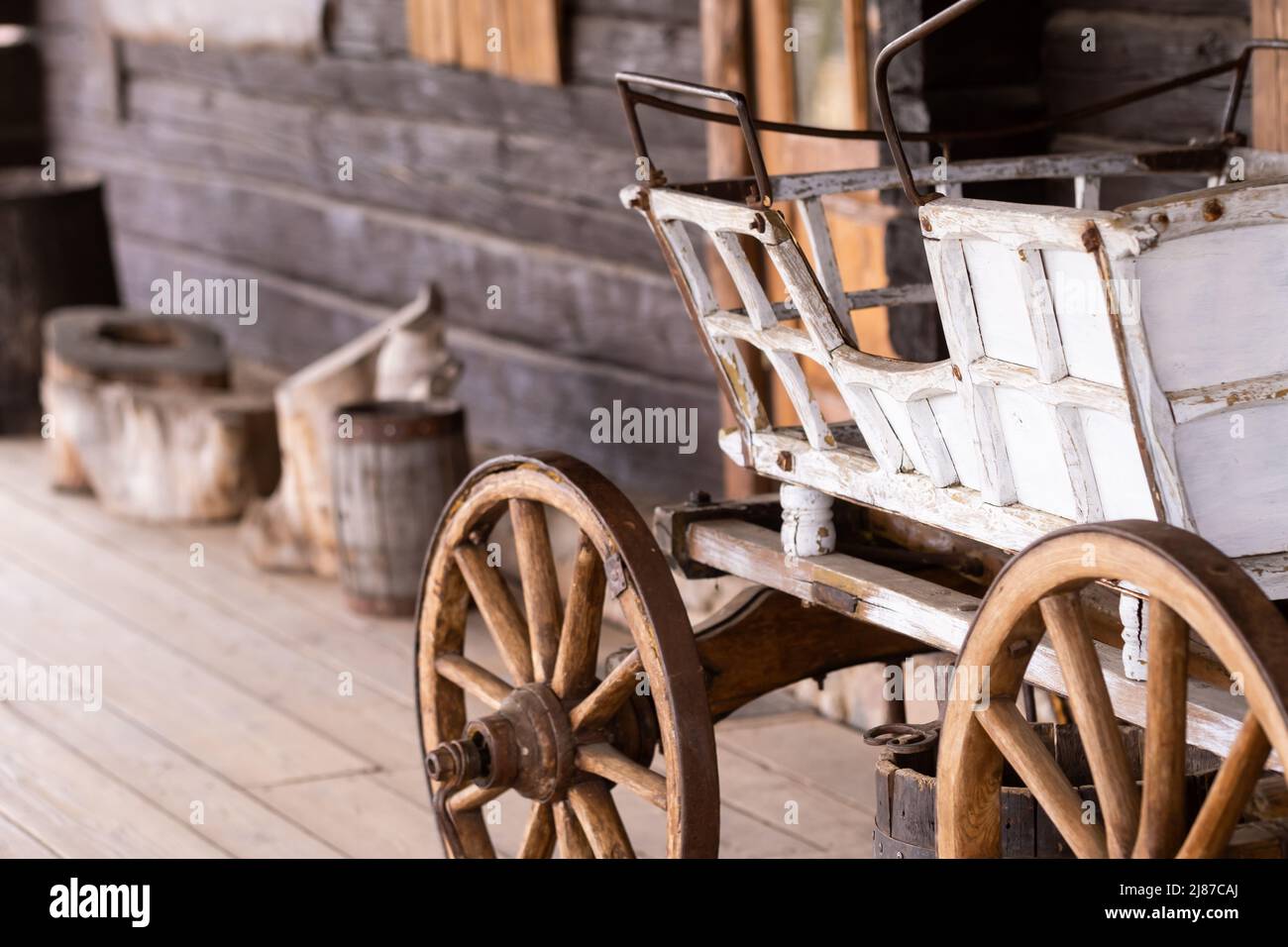 An empty antique carriage stands on a ranch in the wild West Stock ...