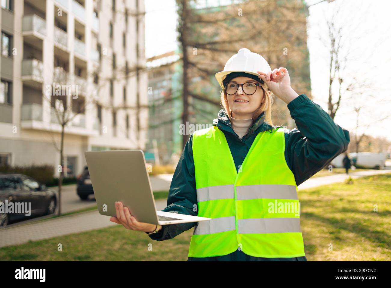 Portrait of engineer beautiful woman worker is standing in white and ...