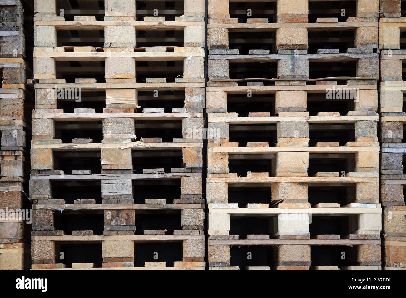 background of many wooden pallets in the storage area without people ...