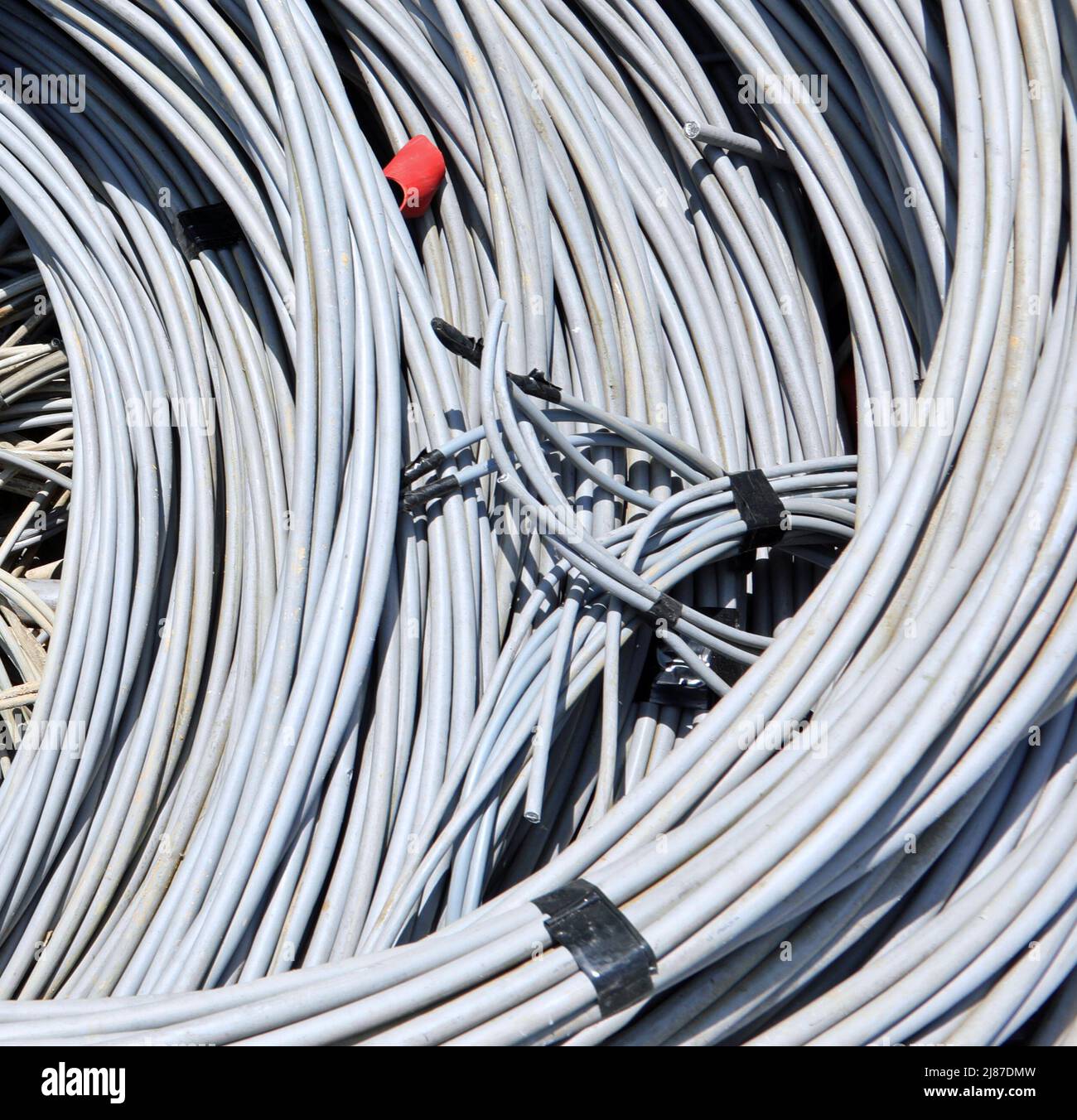 background of many skeins of discarded copper electrical cable in the ...