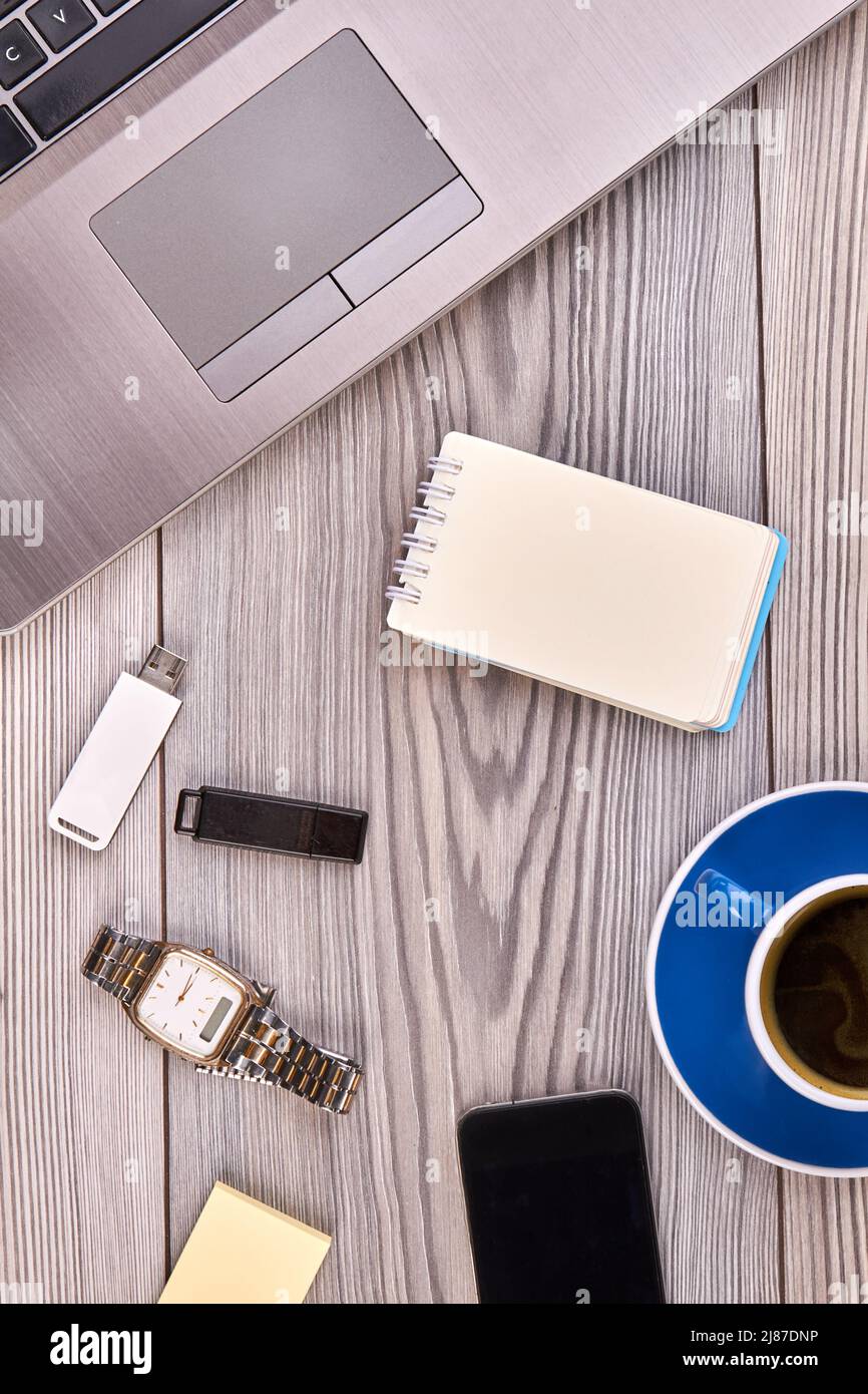 Vertical shot top view flat lay office workdesk on white table. Blank ...