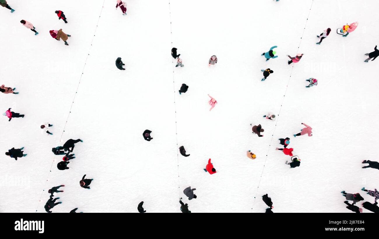 People Skating on an Open-Air Ice Skating Rink. Top View. Many People ...