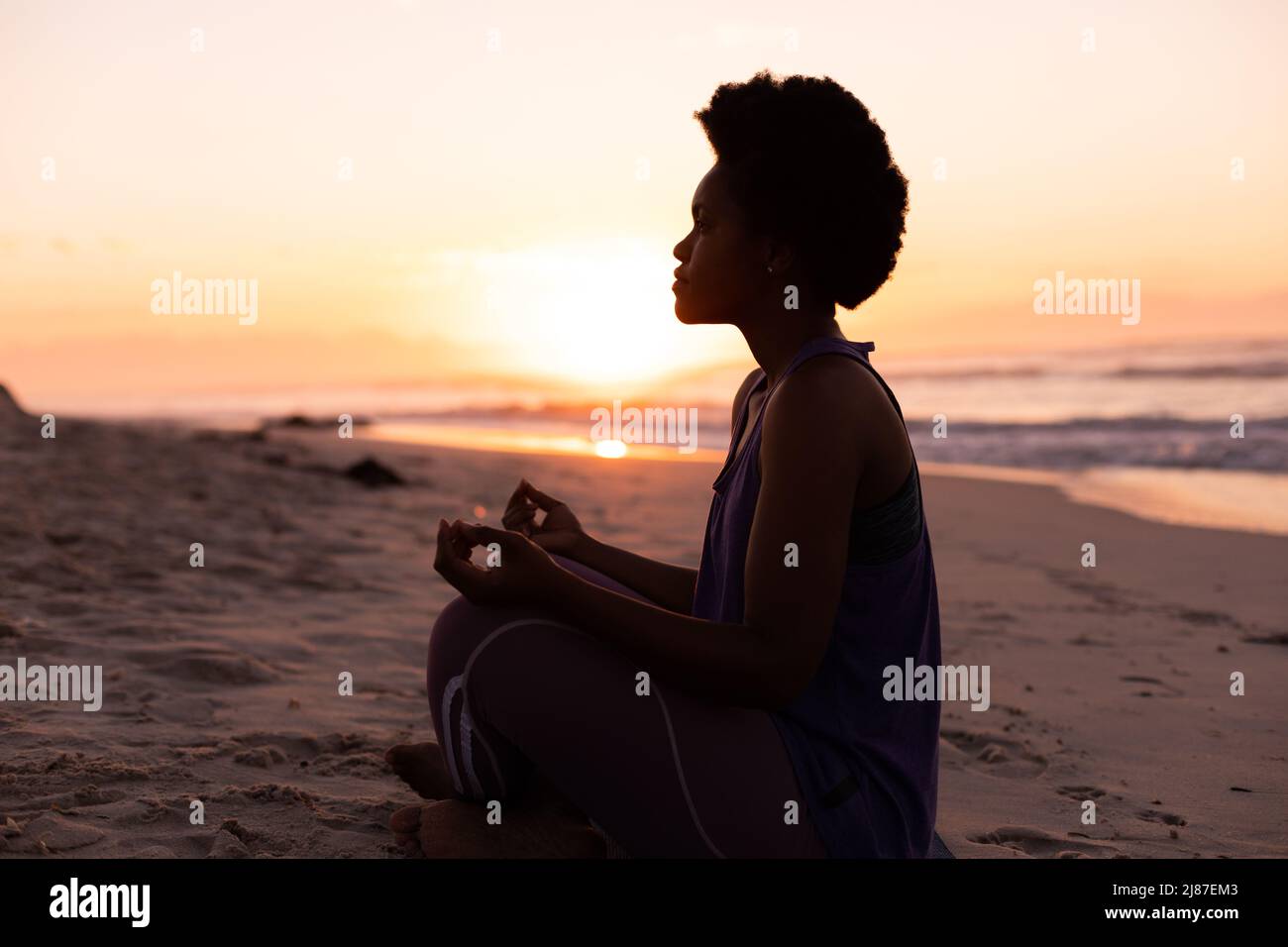 African woman side view sitting hi-res stock photography and images - Alamy