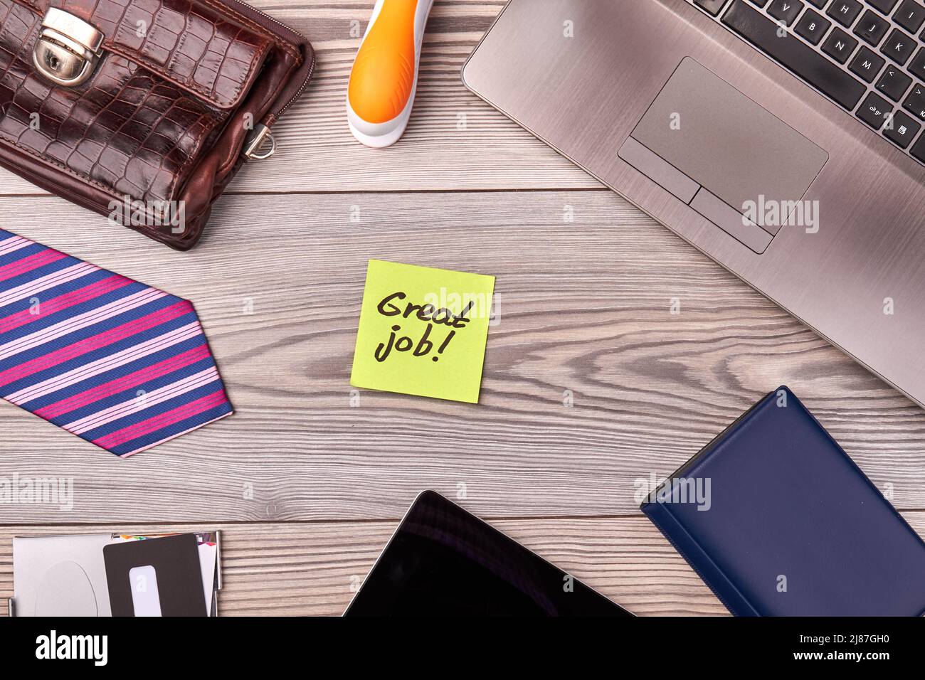 Great job message and mens office stuff on white desk. Top view flat ...