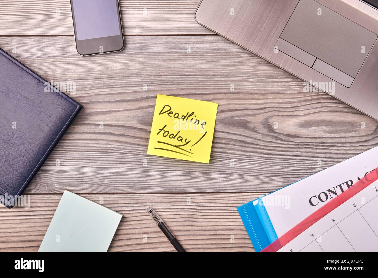 Deadline today handwriting with office stationery items. Top view flat ...