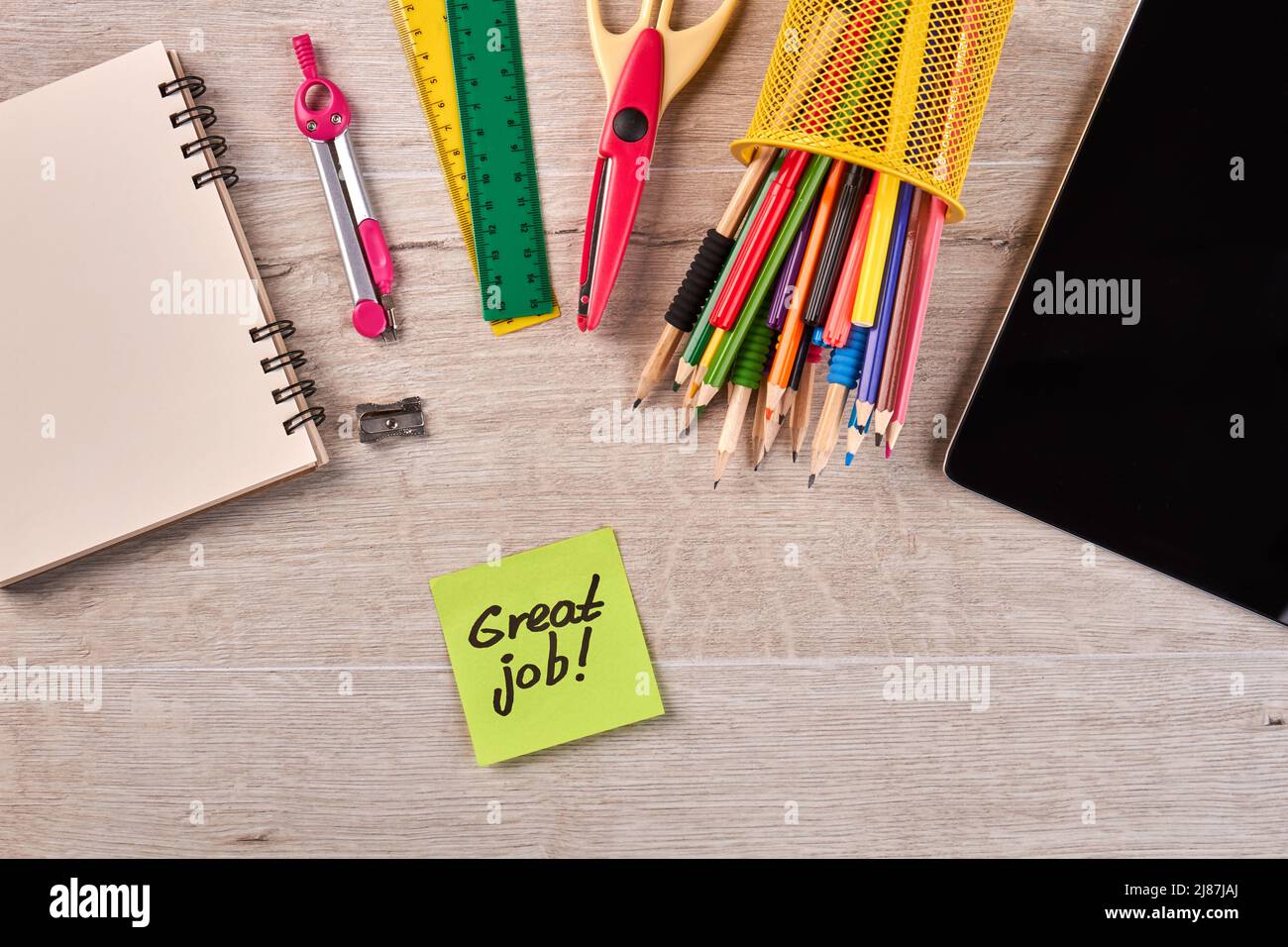 Top view stationery tools and sticky note with great job writing ...