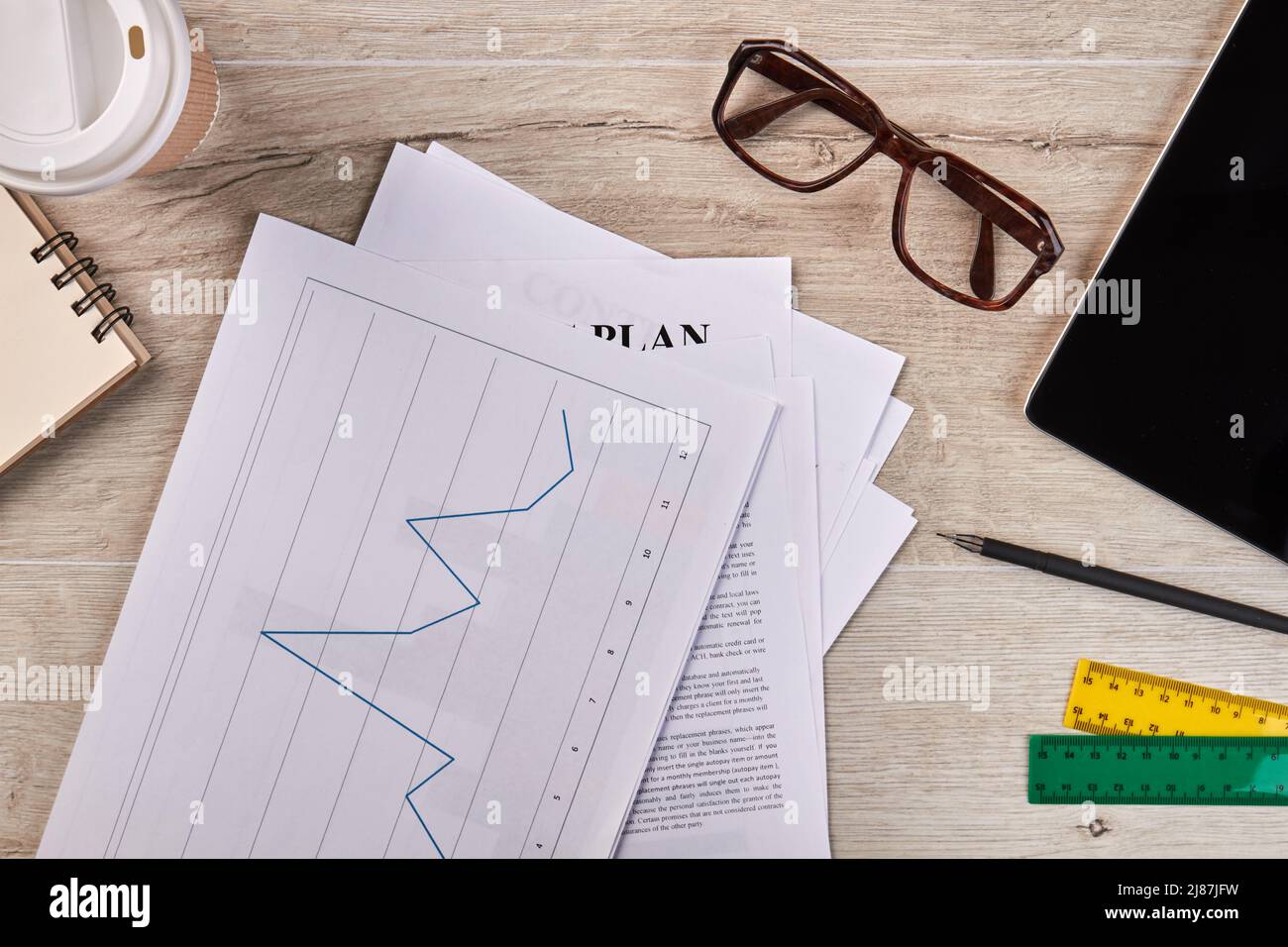 Work papers with statistic graph and glasses. Top view flat lay Stock ...