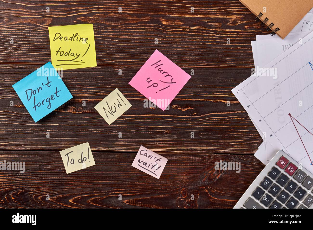 Motivation sticky notes and office work accessories. Brown wood ...