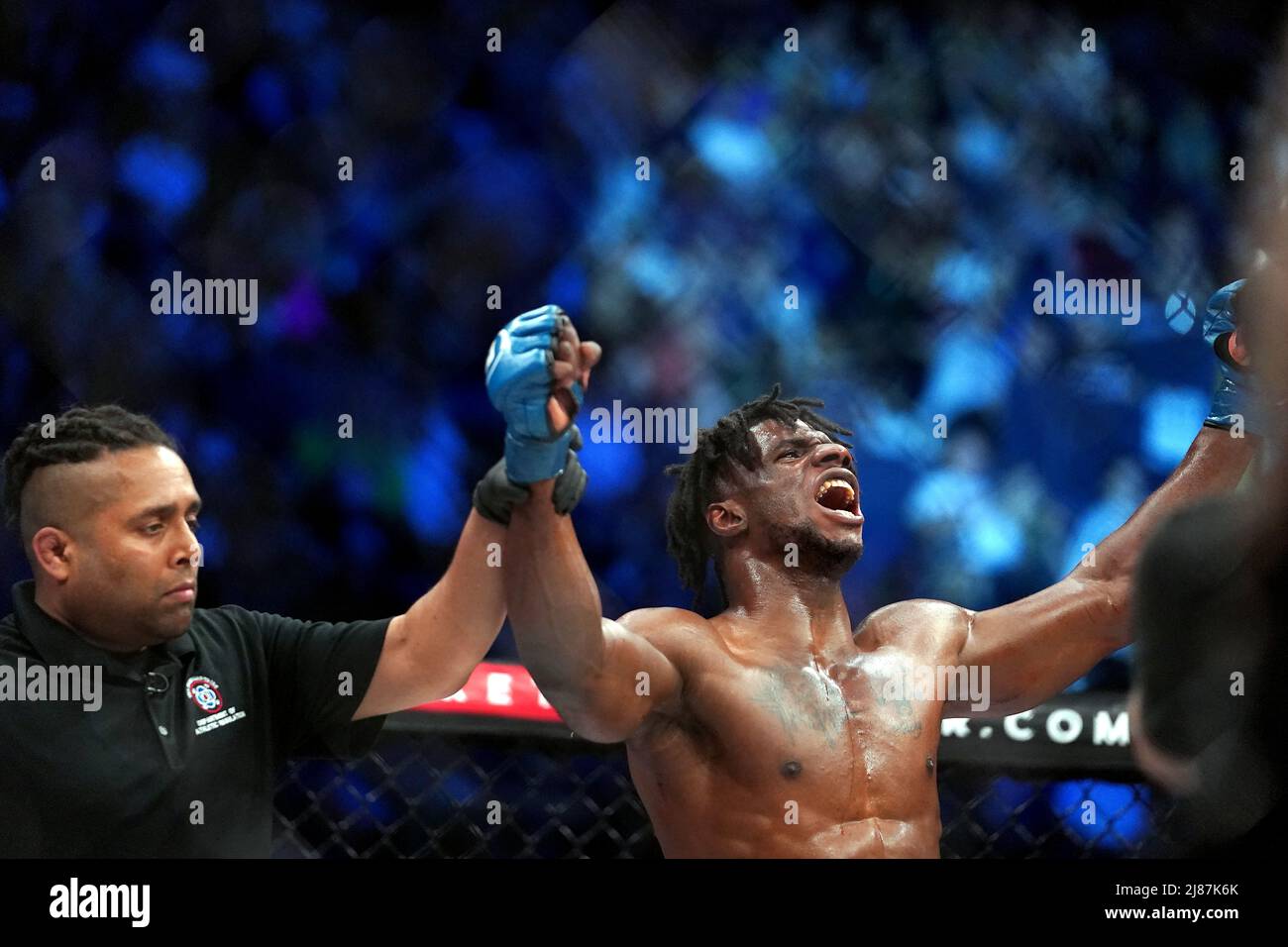 Simon Biyong celebrates victory after the light heavyweights fight at ...
