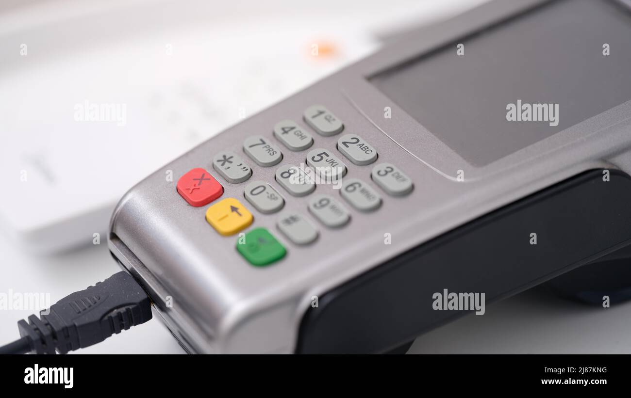 POS terminal for payment with wire closeup Stock Photo - Alamy
