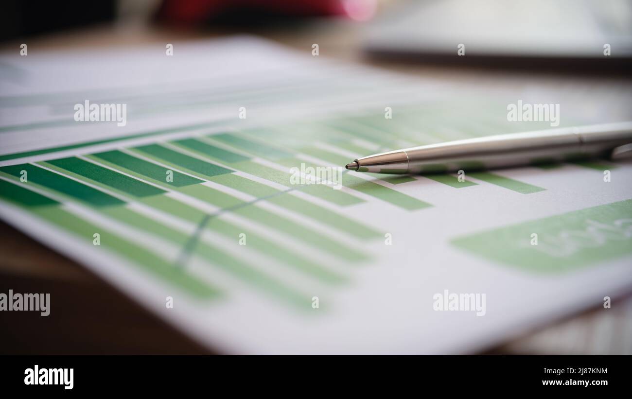 Paper document with pen graphs and diagrams Stock Photo - Alamy