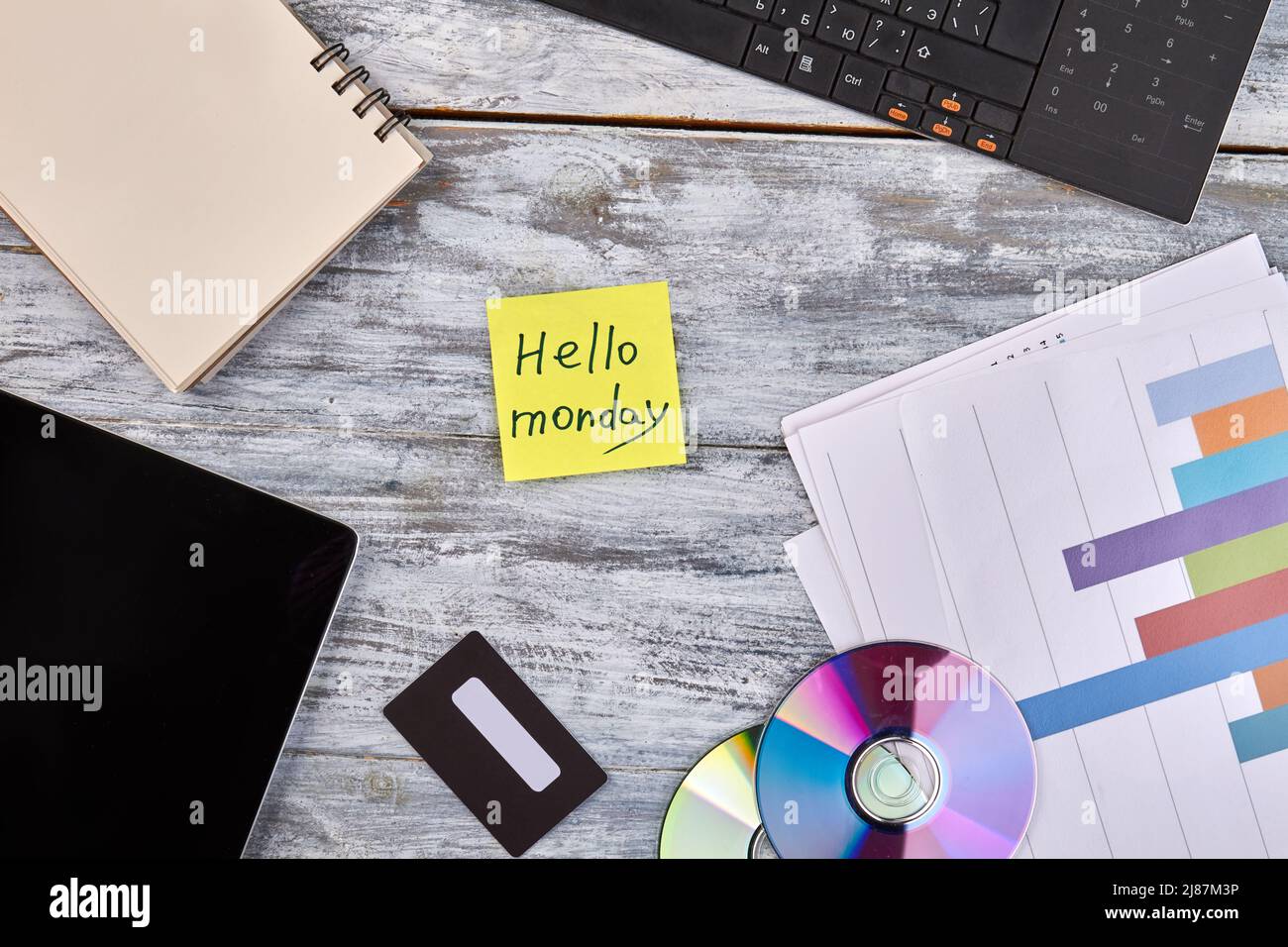 Top view flat lay many office stuff on gray desk. Credit card with disk ...
