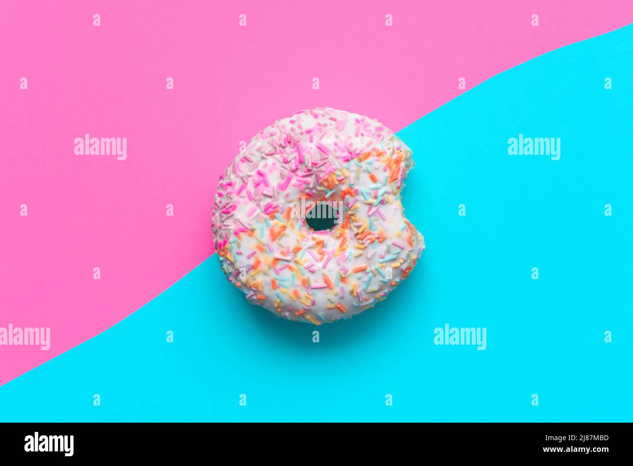 Sugar donut split into half portion to reduce unhealthy food quantities ...