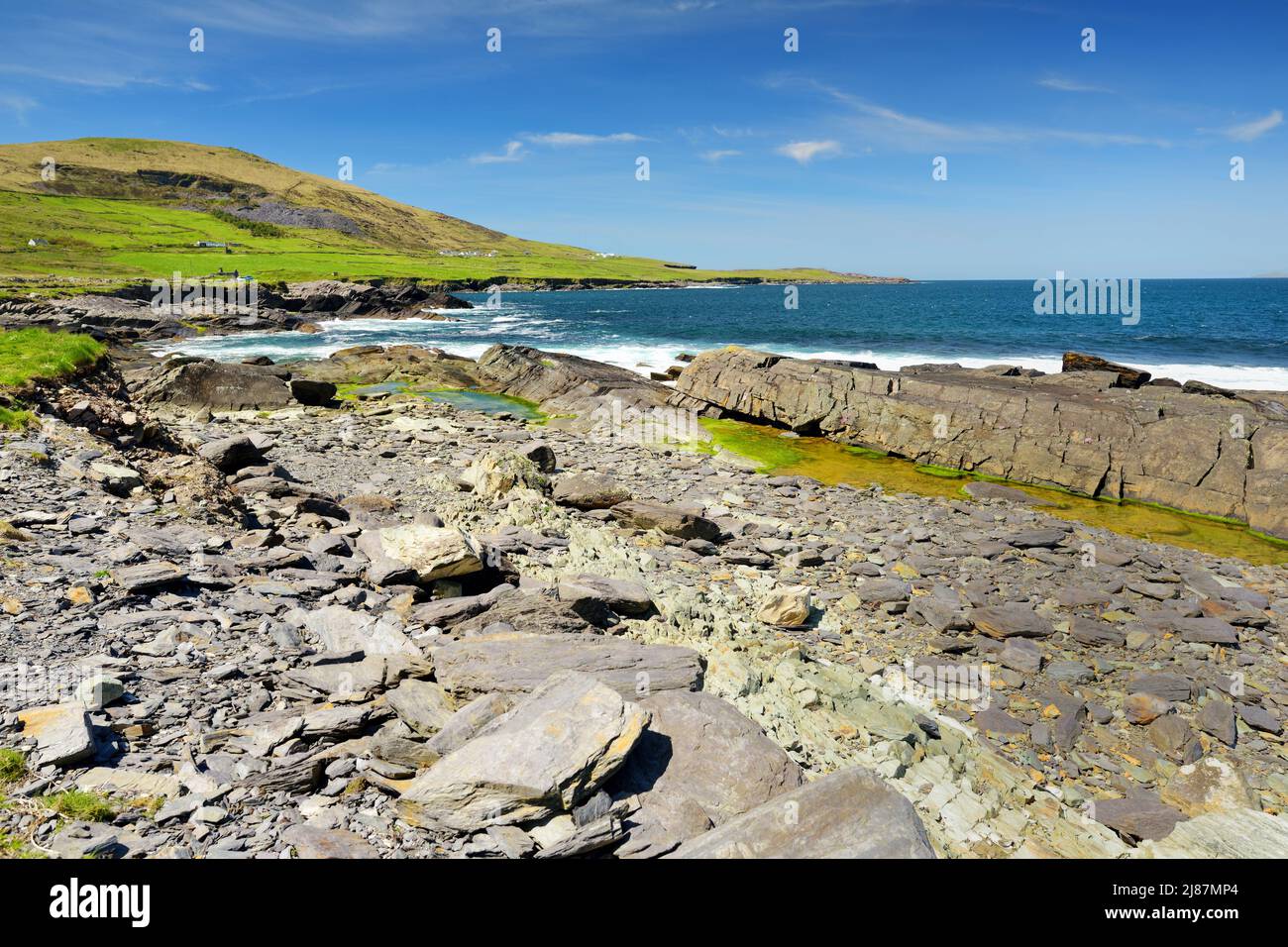 Rough and rocky shore along famous Ring of Kerry route. Rugged coast of ...
