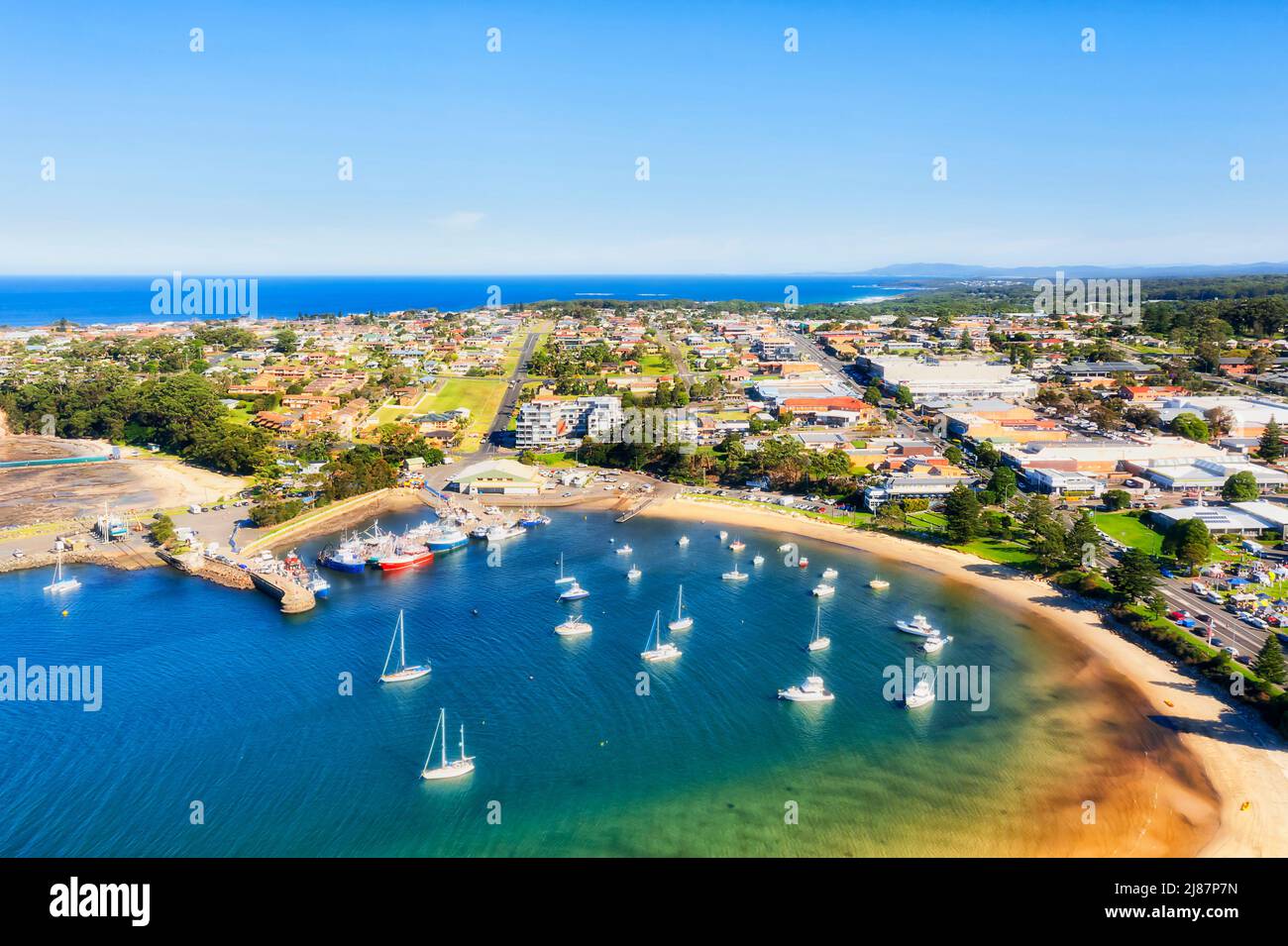 Secluded breakwall protected harbour on Sapphire coast of Australia in ...