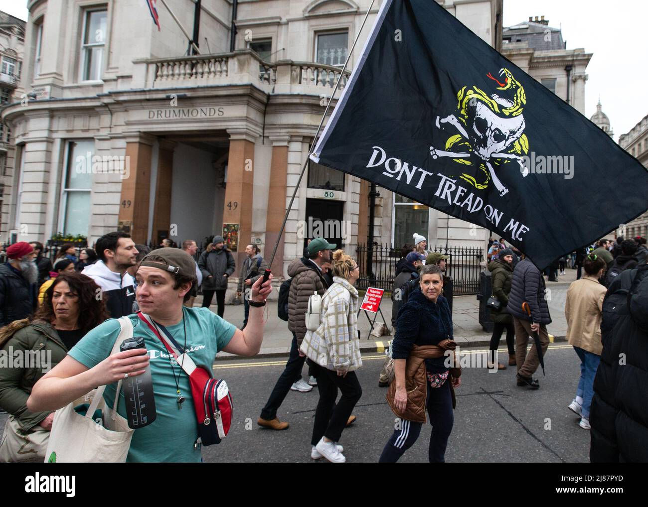 Crowds march through central London during an anti-lockdown protest ...