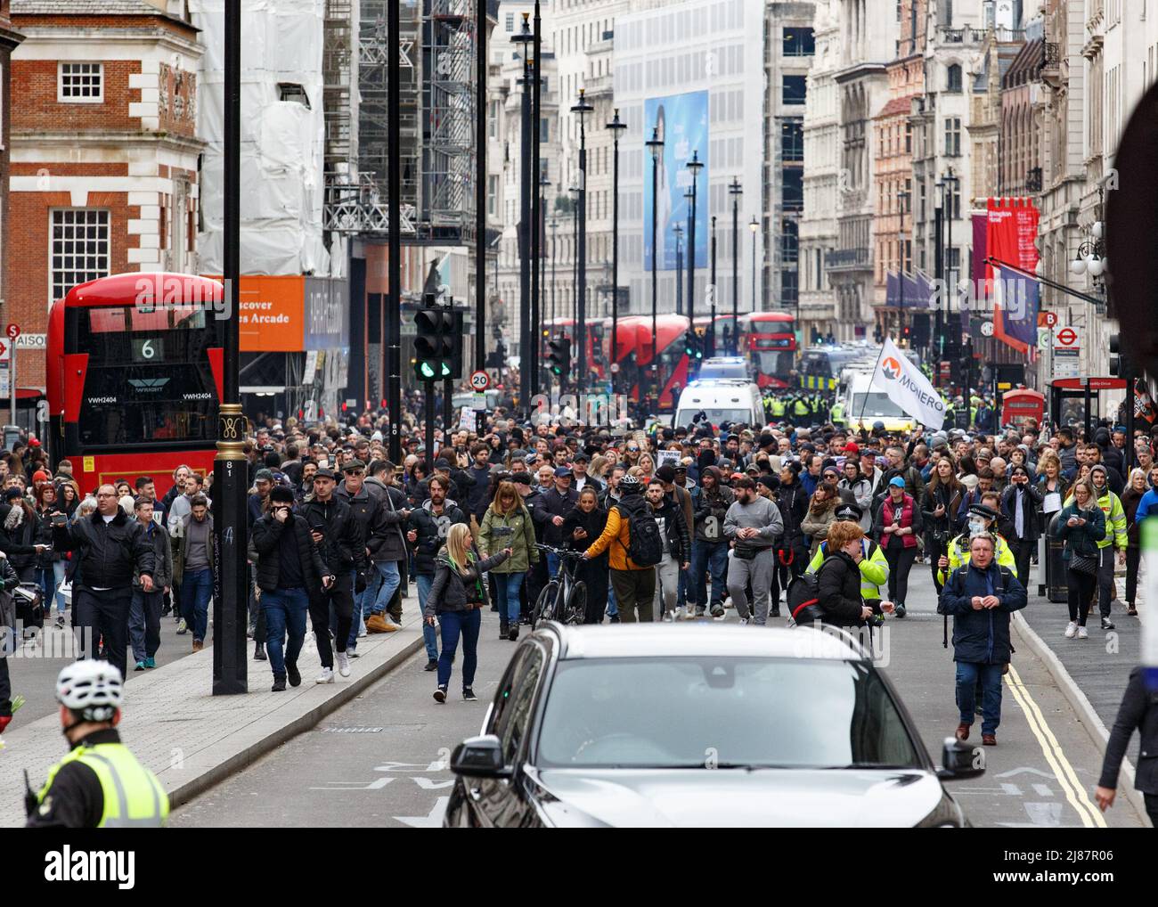 Crowds march through central London during an anti-lockdown protest ...