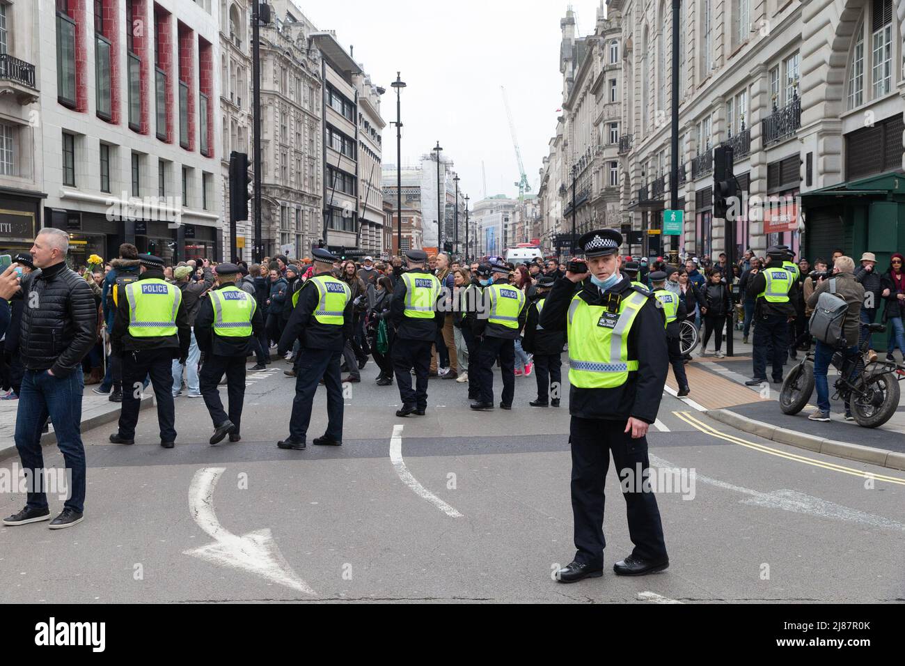 Crowds march through central London during an anti-lockdown protest ...
