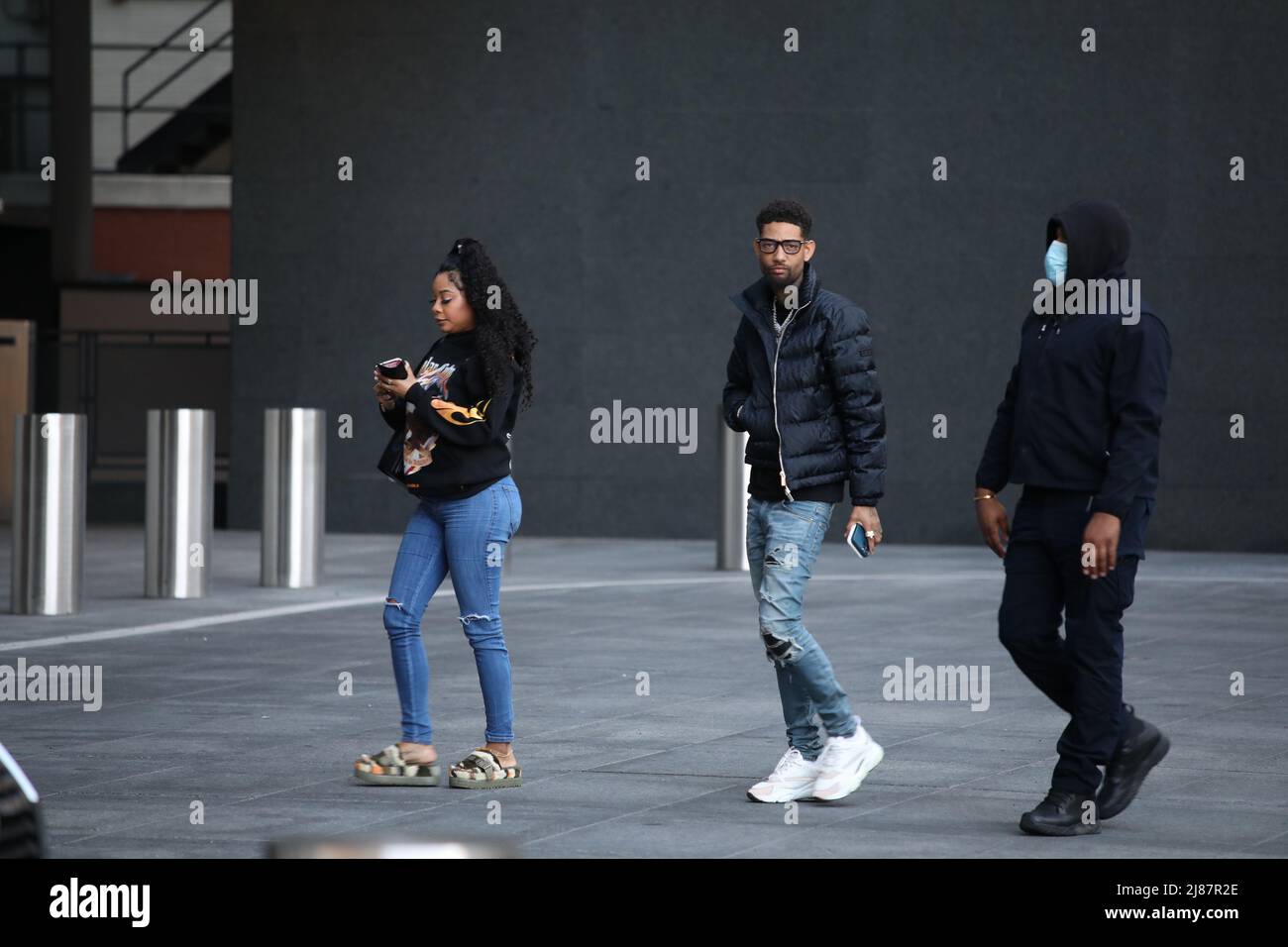 Rapper PnB Rock signs an autograph for a fan before he enters the Four ...