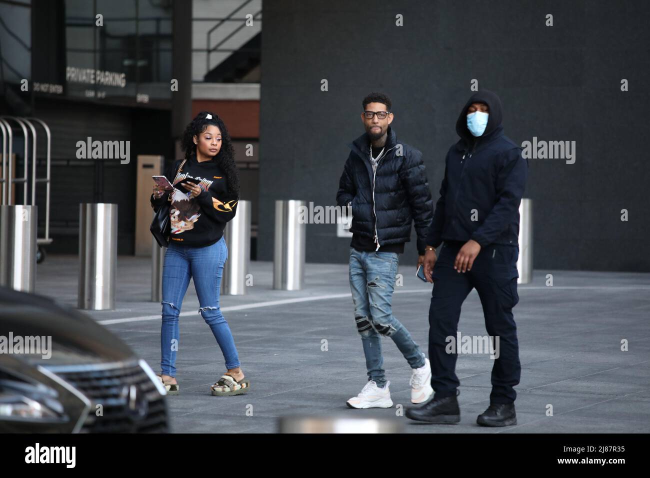 Rapper PnB Rock signs an autograph for a fan before he enters the Four ...