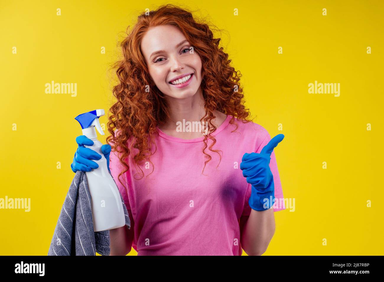cute red haired afro curly ginger woman washing home,studuo yellow wall ...