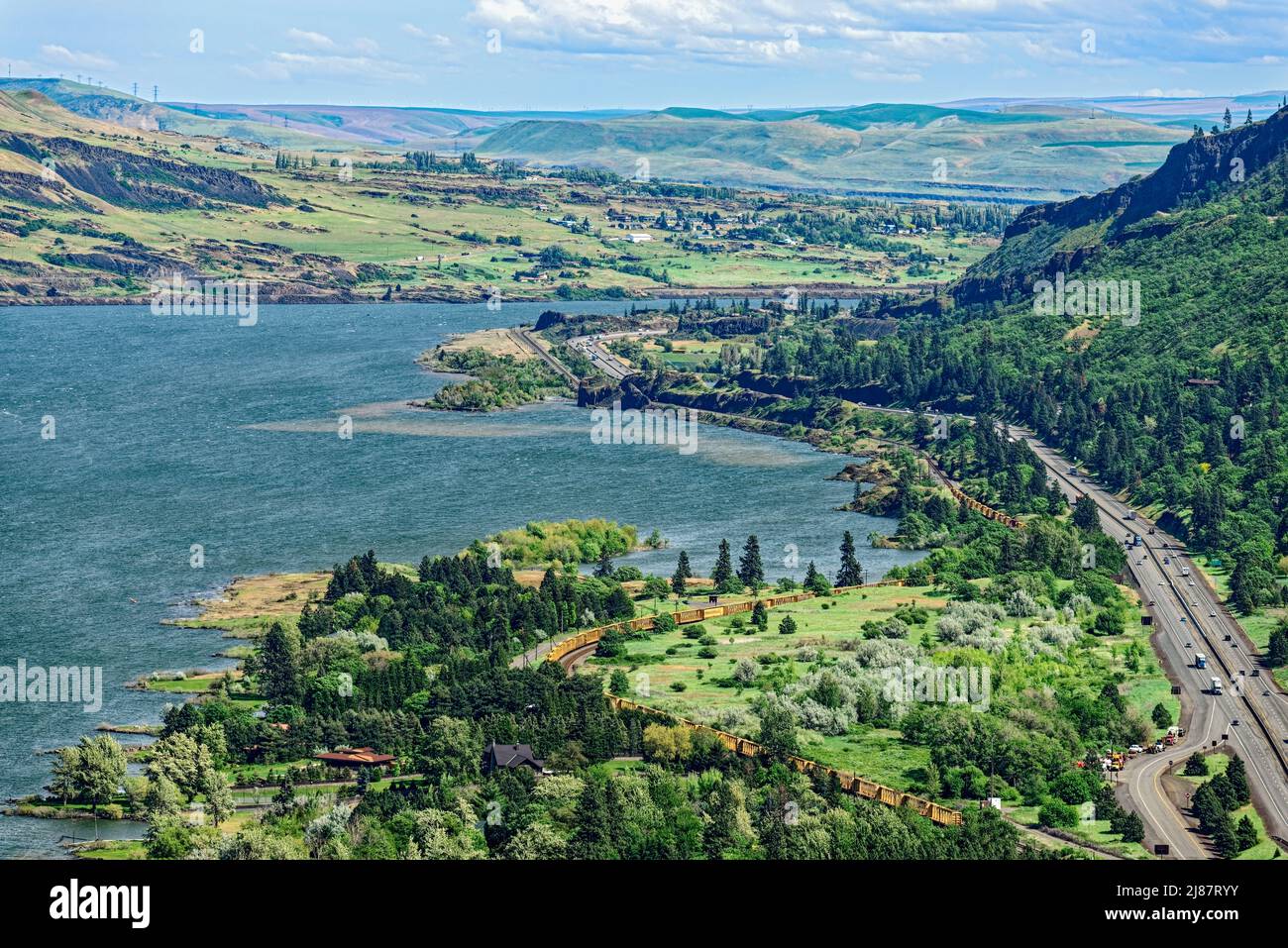 Railroad tracks and Interstate 84 run along the riverside in the ...