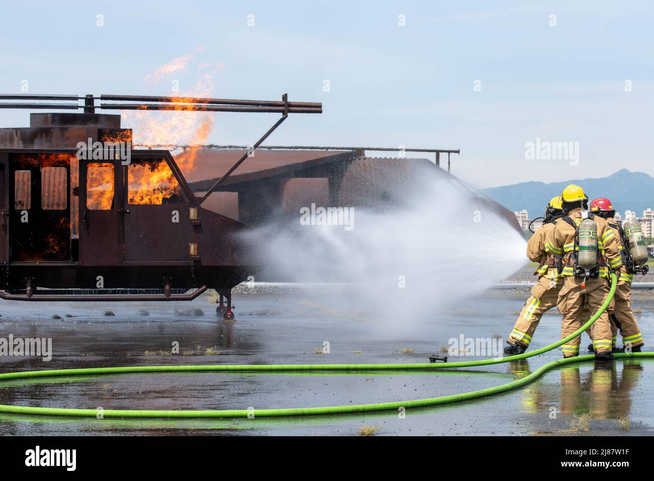 Firefighters with the 374th Civil Engineer Squadron Fire Department ...