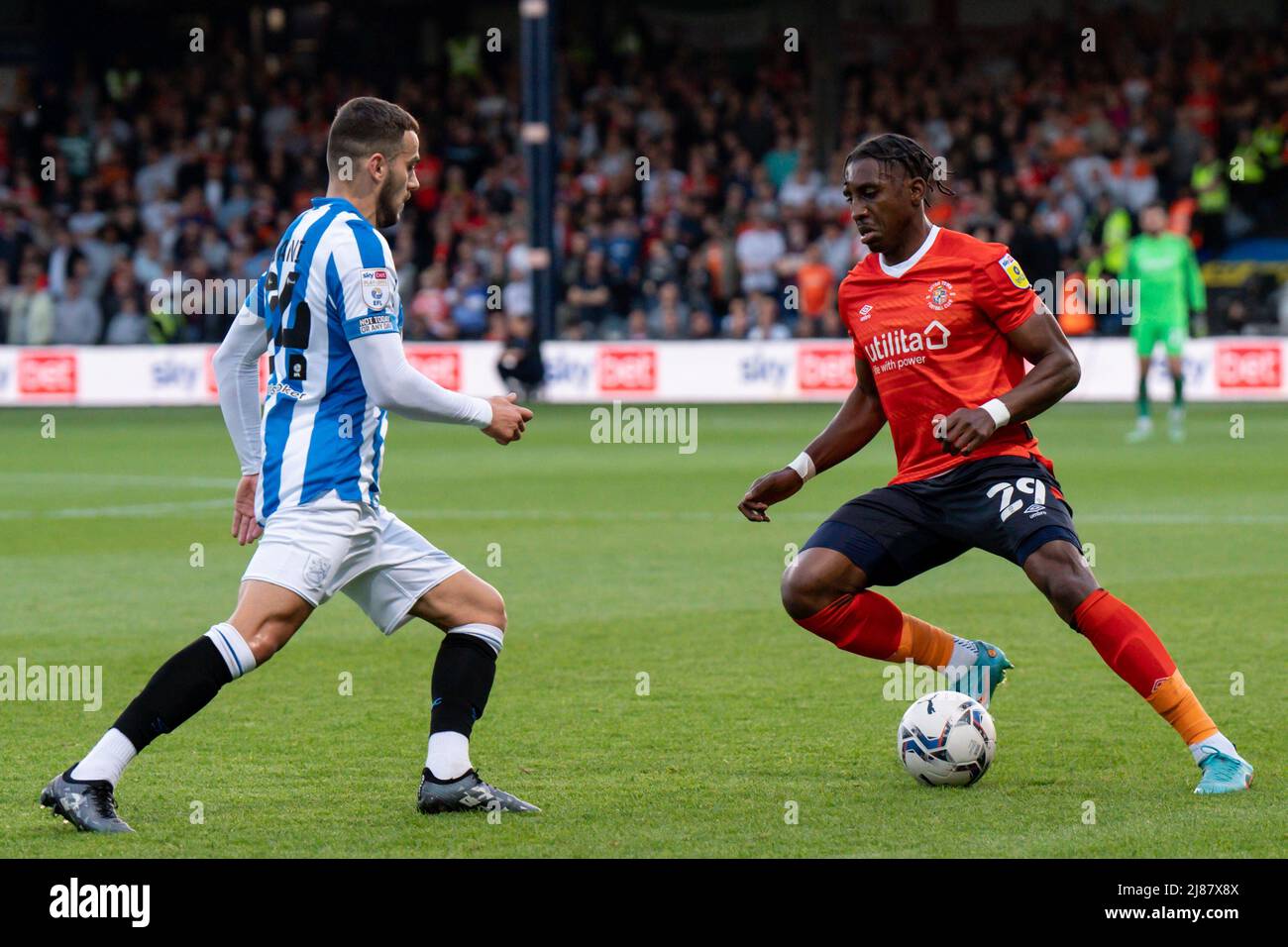 Amari’i Bell #29 of Luton Town battles for the ball with Daniel Sinani ...