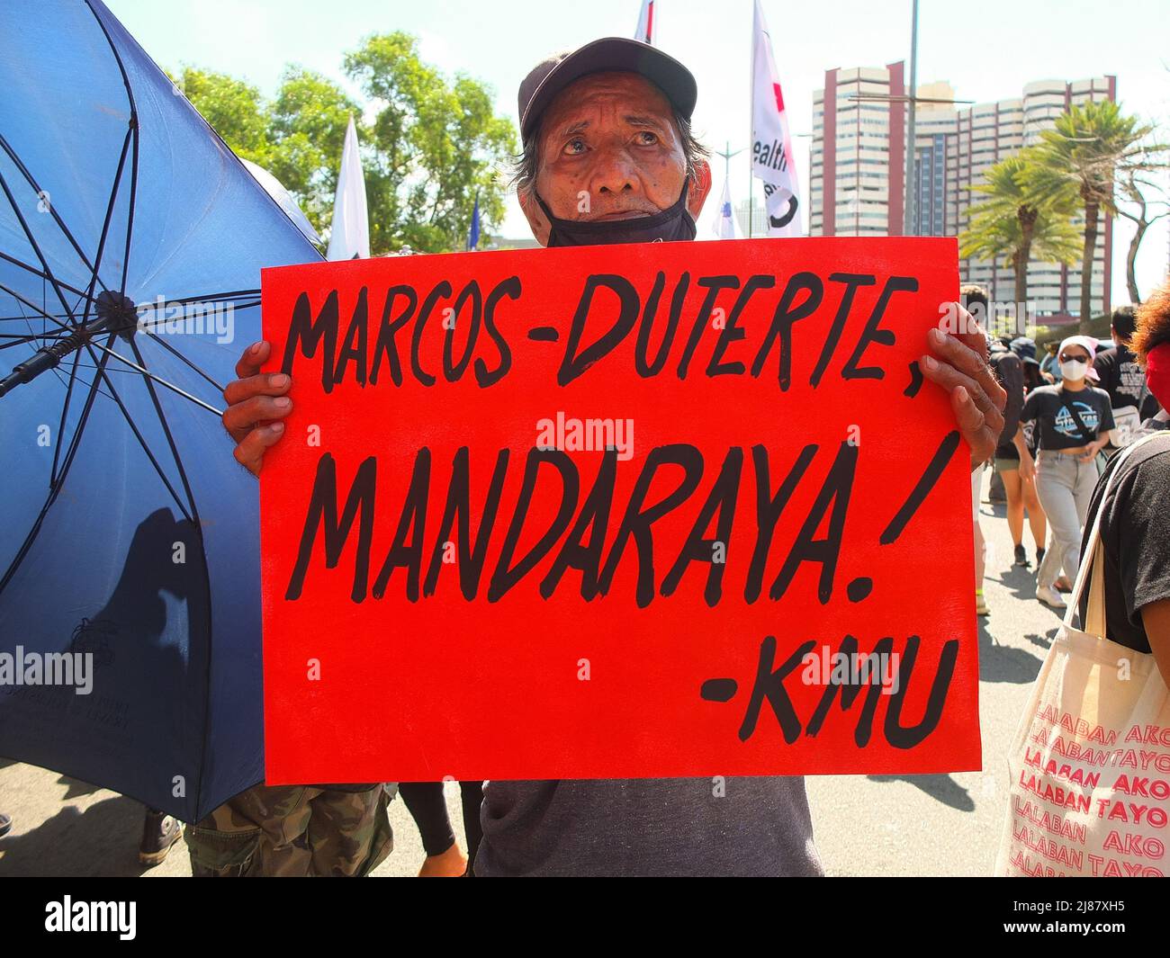 A protester holds a placard expressing his opinion during the ...