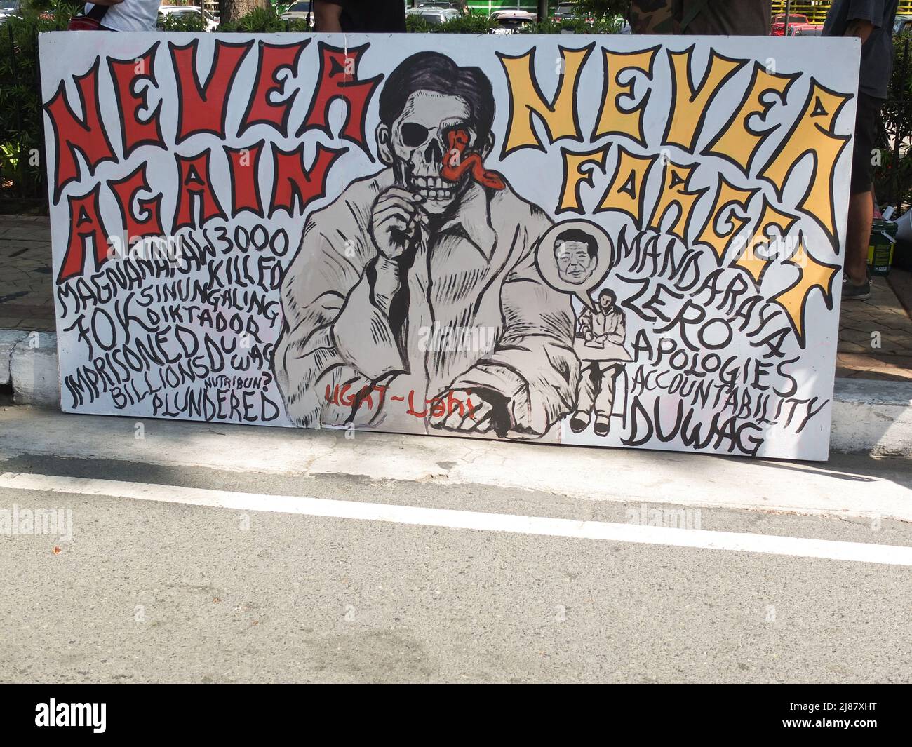 A horrific satire painting by an activist was put on a pavement during ...