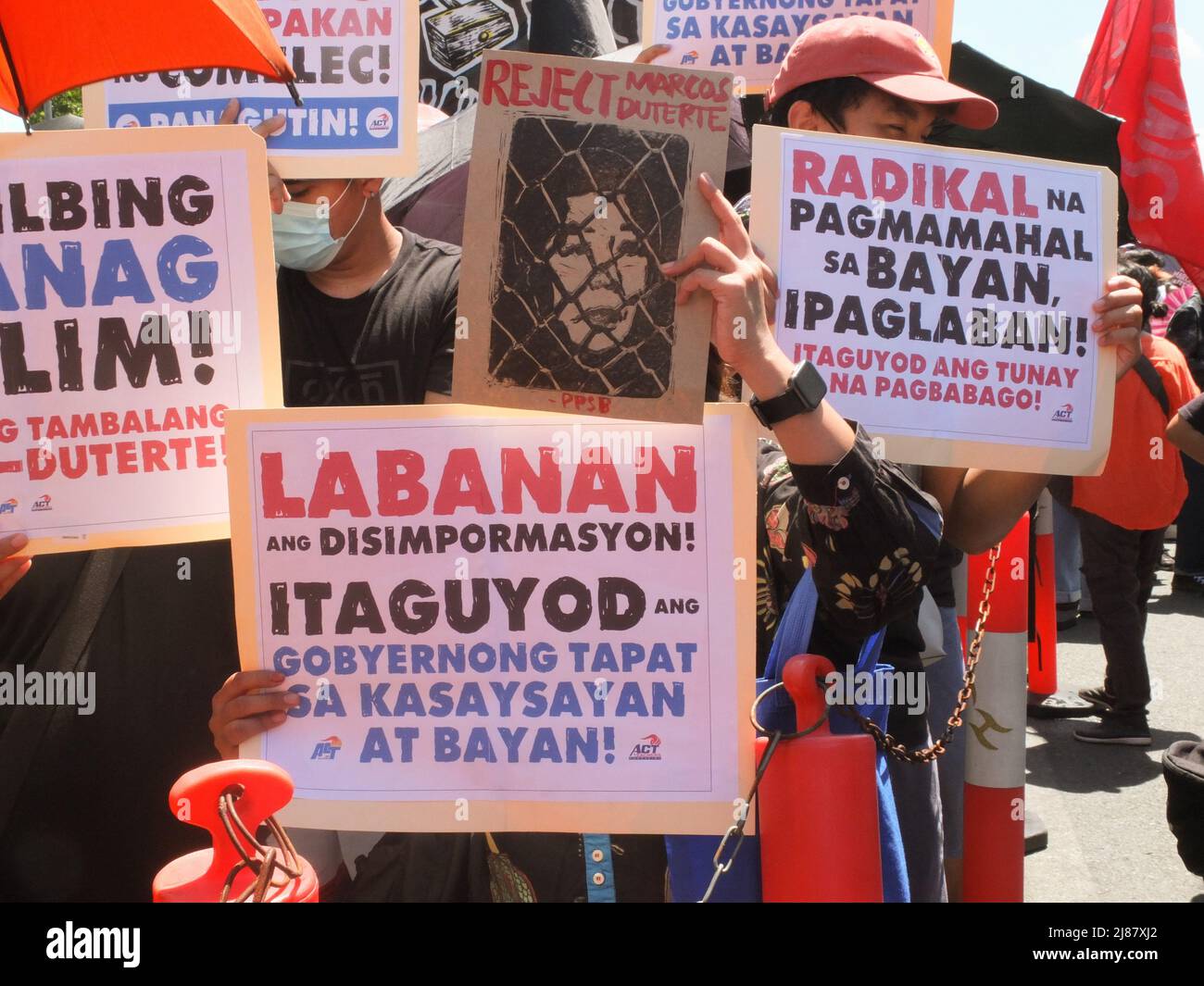 Protesters hold placards expressing their opinion during the ...