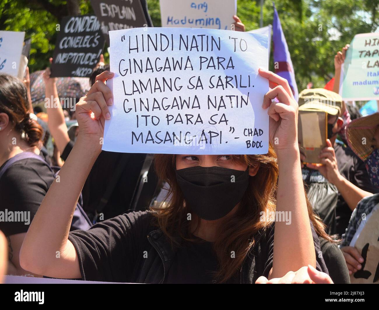 A protester holds a placard expressing her opinion during the ...