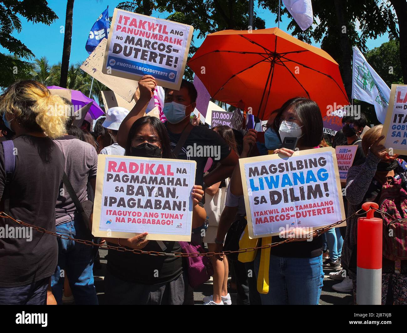 Protesters hold placards expressing their opinion during the ...