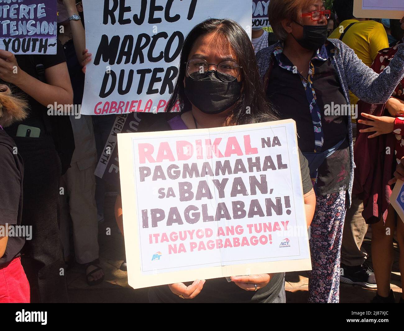 A protester holds a placard expressing her opinion during the ...