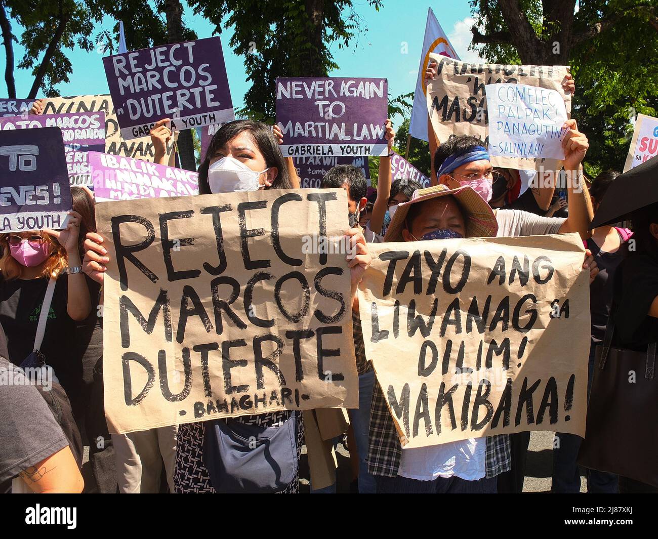 Protesters hold placards expressing their opinion during the ...
