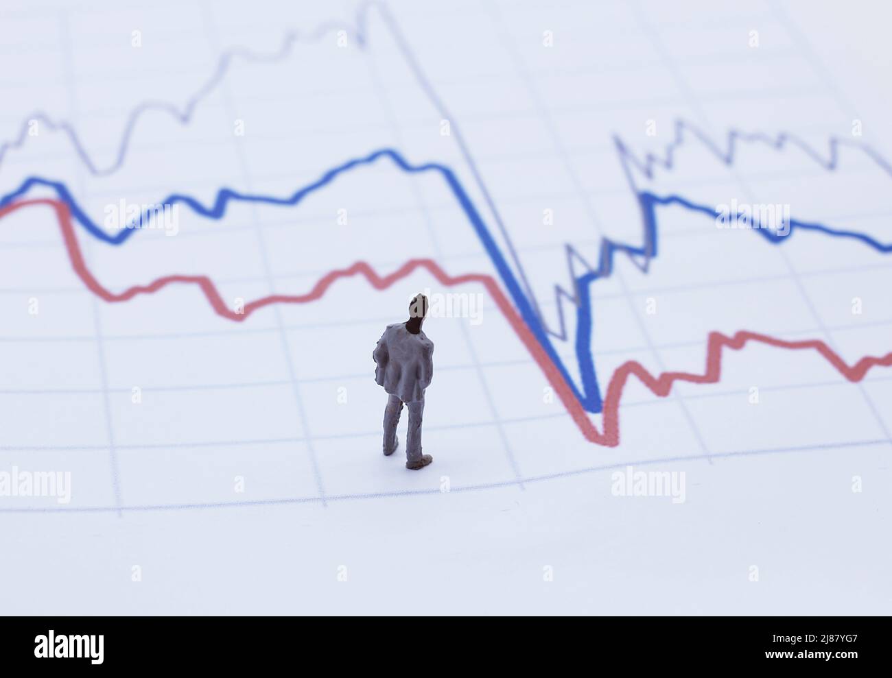 Business man watching the collapse of prices on a graph. Investment and ...