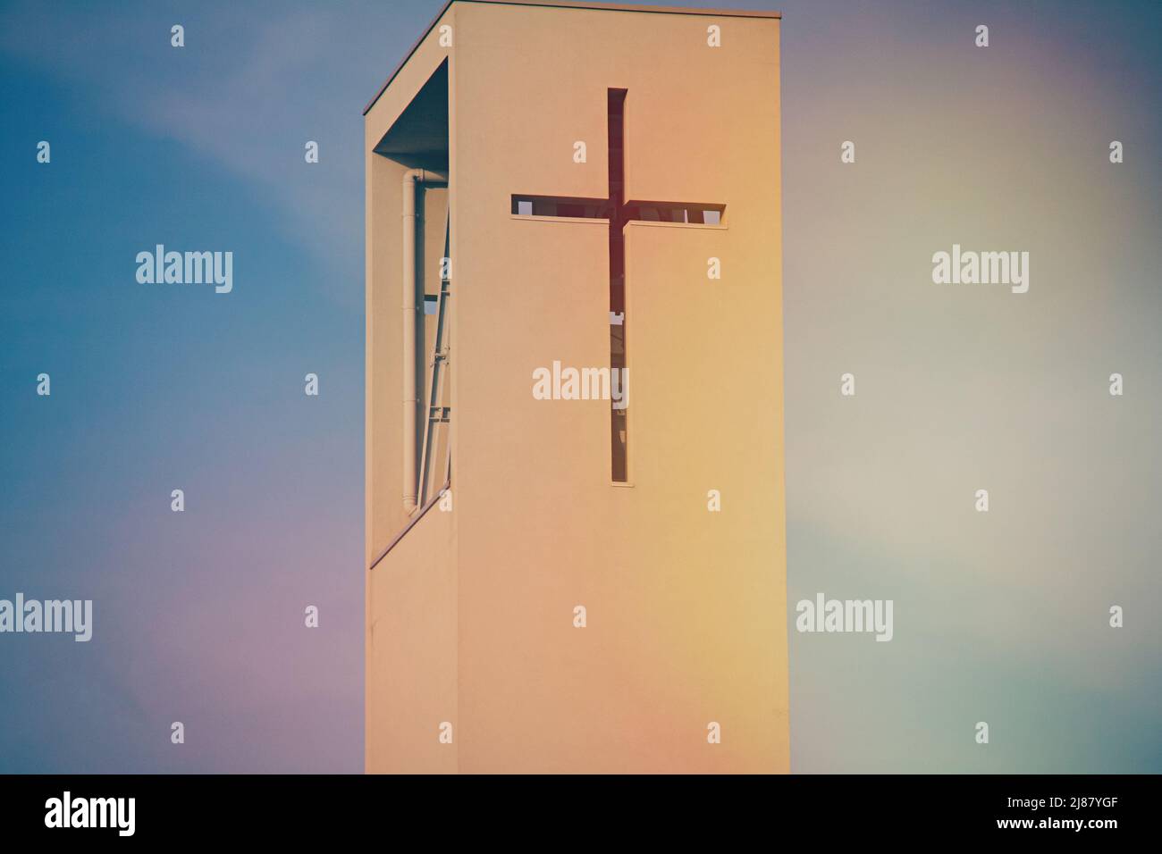 Shot of a modern bell of a church with a cross Stock Photo - Alamy