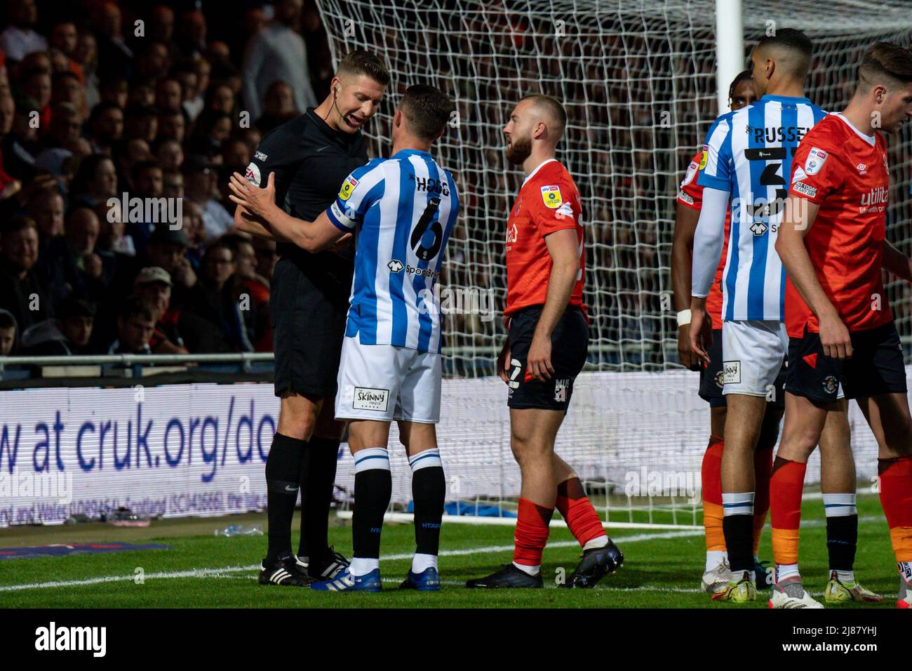 Referee Robert Jones has a word with Jonathan Hogg #6 of Huddersfield ...
