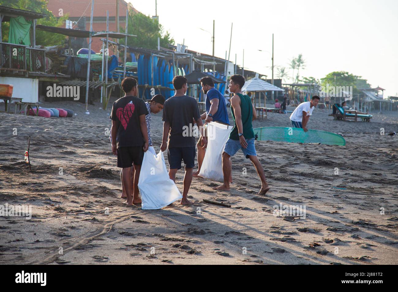 A group of local people at Batu Bolong Beach in Canggu, Bali, Indonesia ...